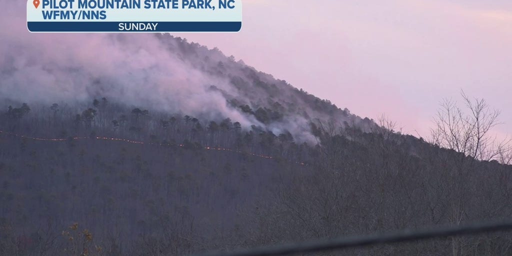 Watch: Large wildfire burns on Pilot Mountain in North Carolina ...