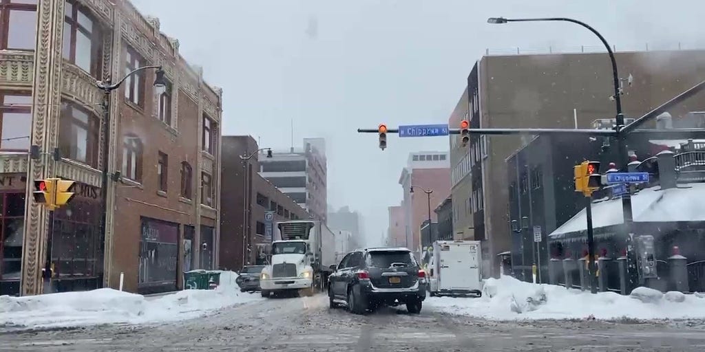 Roads remain slick as snow continues to fall in Buffalo, New York ...