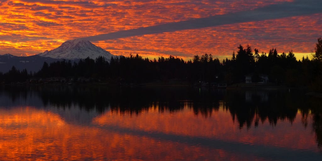 Surreal sunrise gives a spooky shadow off Mt. Rainier | Latest Weather ...