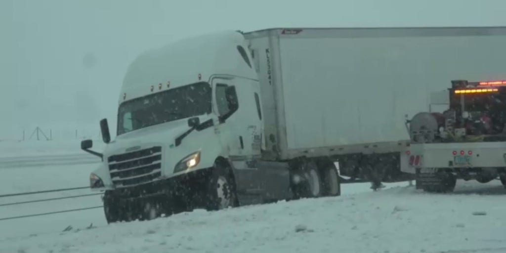 Snow piling up on Interstate 94 in North Dakota as blizzard conditions ...