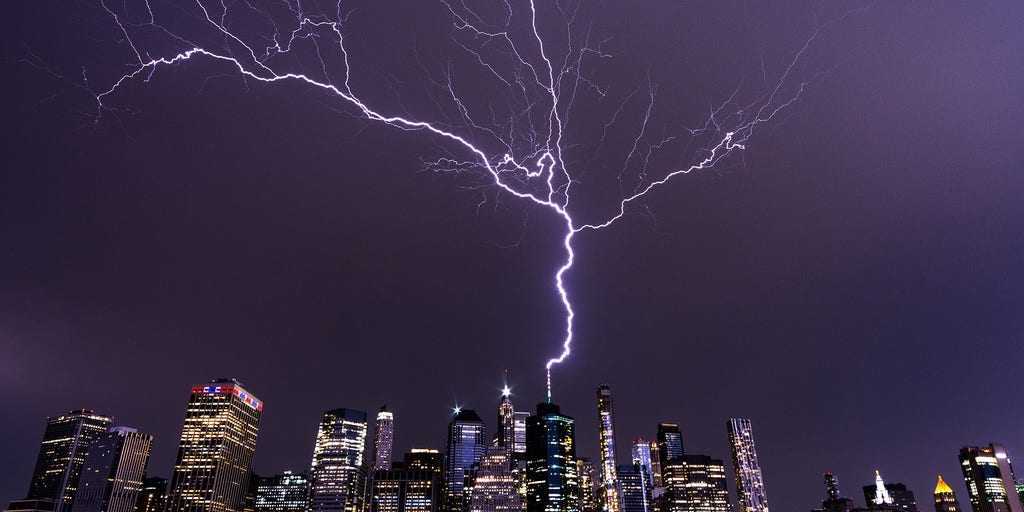 Backwards bolt: Watch as lightning heads skyward from NYC's World Trade ...