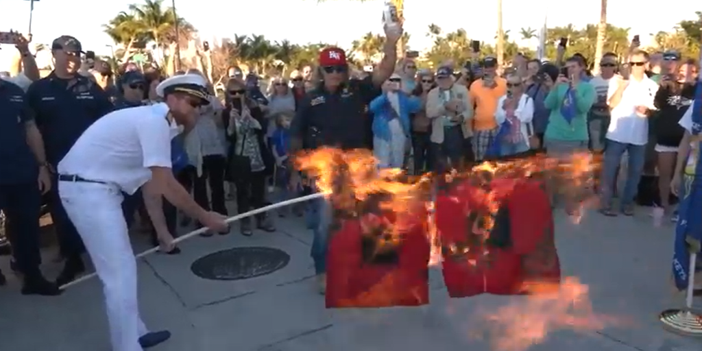 Floridians mark the end of tropical season by burning hurricane flags ...