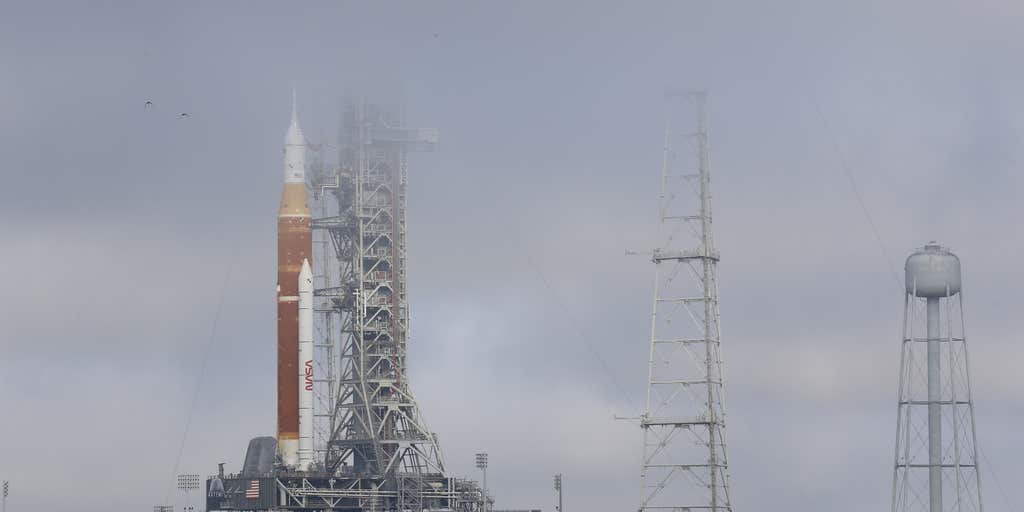 PHOTOS: NASA's massive moon rocket rises out of thick fog at Kennedy ...