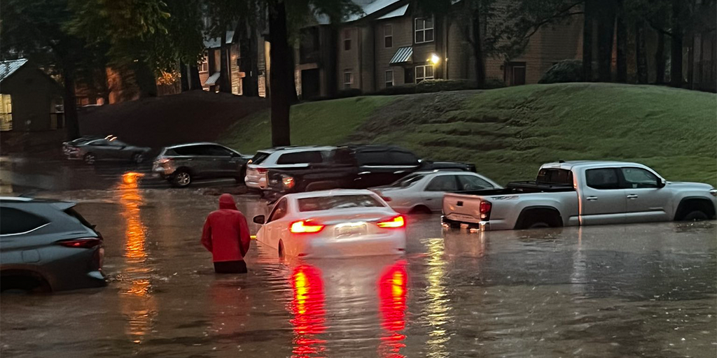 Drivers warned to stay off roads after torrential rain leads to flash ...