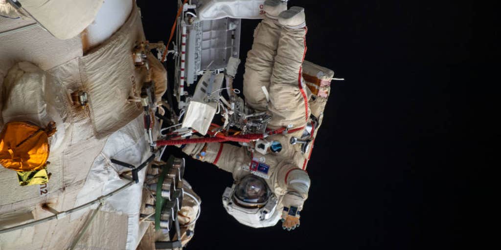 Spacewalking astronauts continue work on space station's third robotic ...