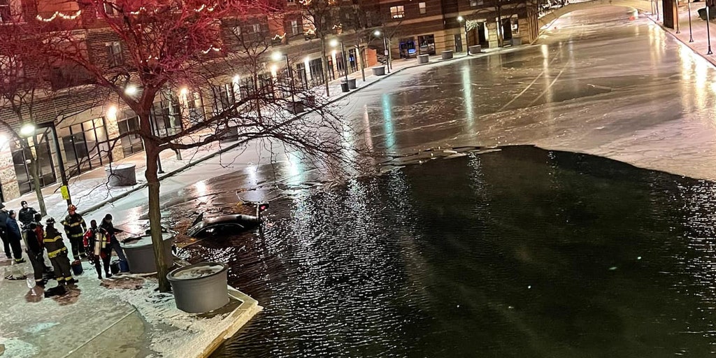 Driver's wayward jaunt along frozen canal ends in crash through thin ...