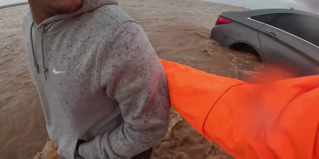 Watch storm chaser's dramatic rescue of stranded driver on flooded ...