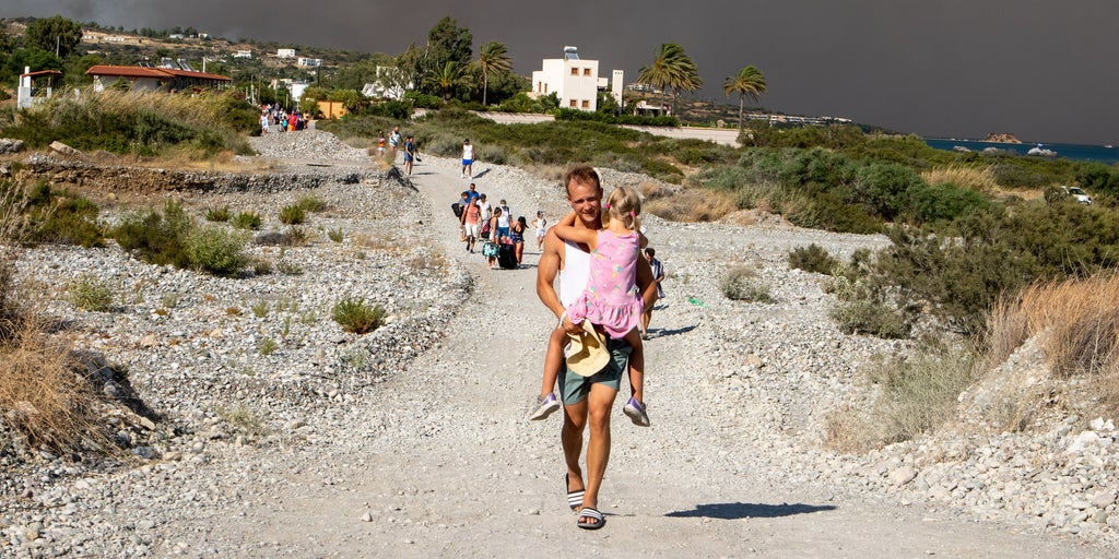 Greece wildfires force thousands to flee Rhodes as hundreds of ...