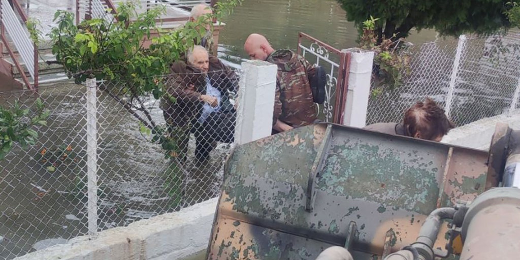 Bulldozers wade through 'biblical' floodwaters in Greece, rescuing ...