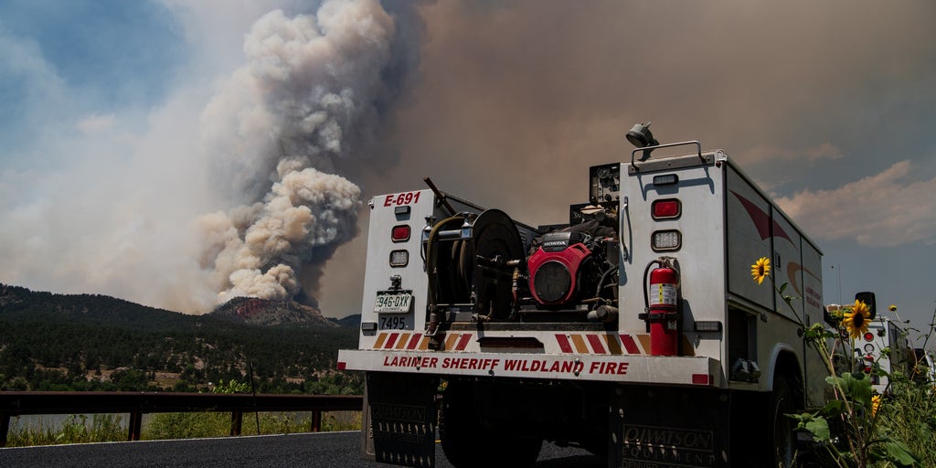 At least 2 dozen structures burned as wildfires rage outside Denver ...