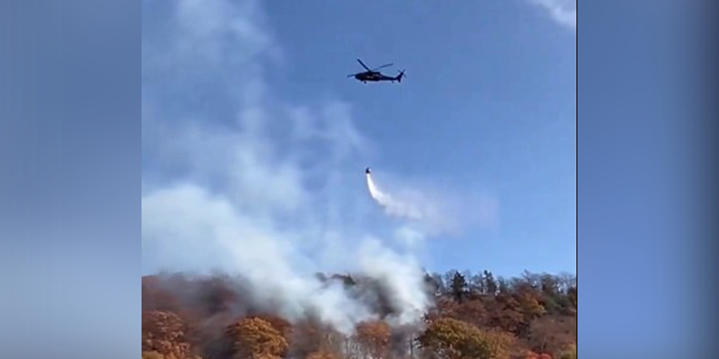 Wildfire danger persists in Northeast as work to extinguish deadly ...