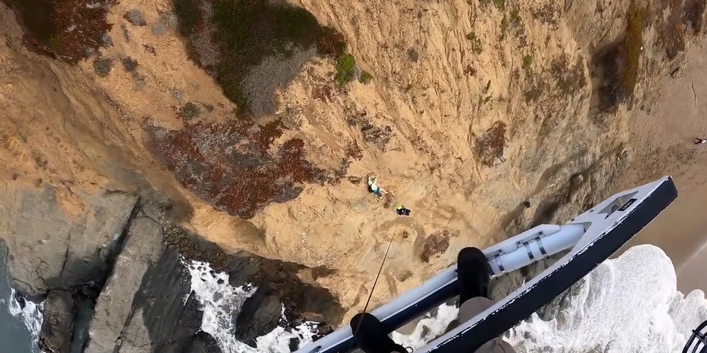 VIDEO: Man screams for help while clinging to cliff high above ...