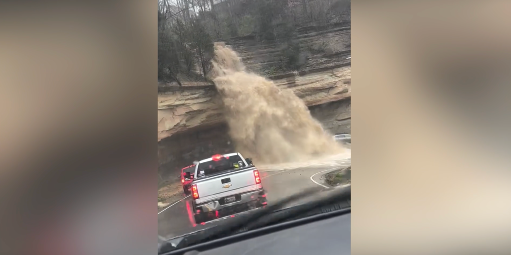 VIDEO: Raging Indiana waterfall pours floodwater onto cars below | Fox ...