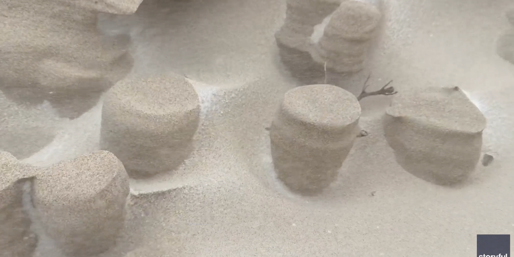Video: Freezing winds erode sand into tiny sculptures along Michigan ...